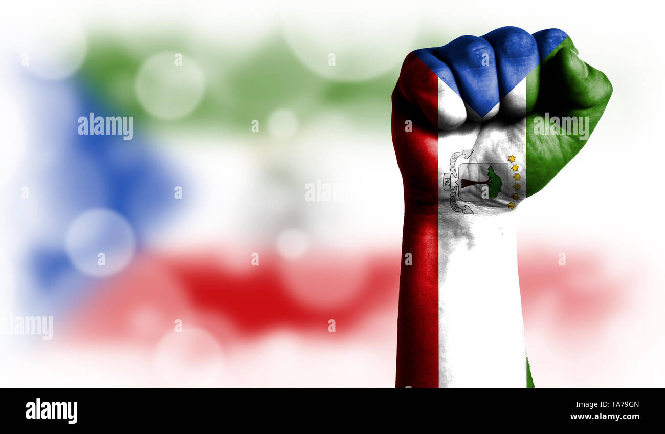 Flag of Equatorial Guinea painted on male fist, strength,power,concept ...