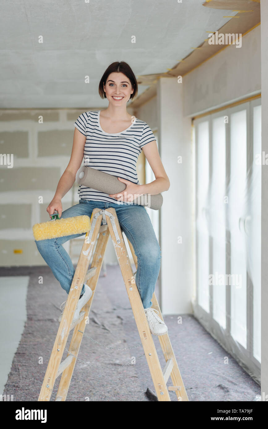 Woman on stepladder hi-res stock photography and images - Alamy