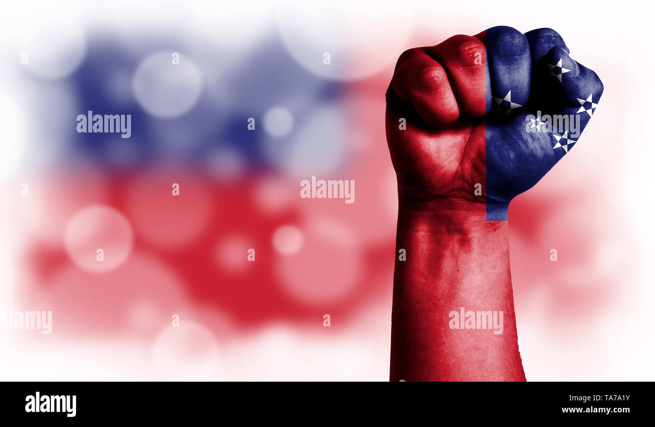 Flag of Samoa painted on male fist, strength,power,concept of conflict ...