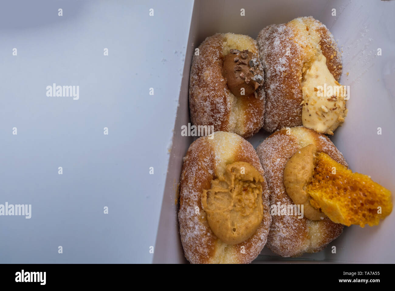Delicious Sweet donuts, cream filling In a paper box in market bakery ...