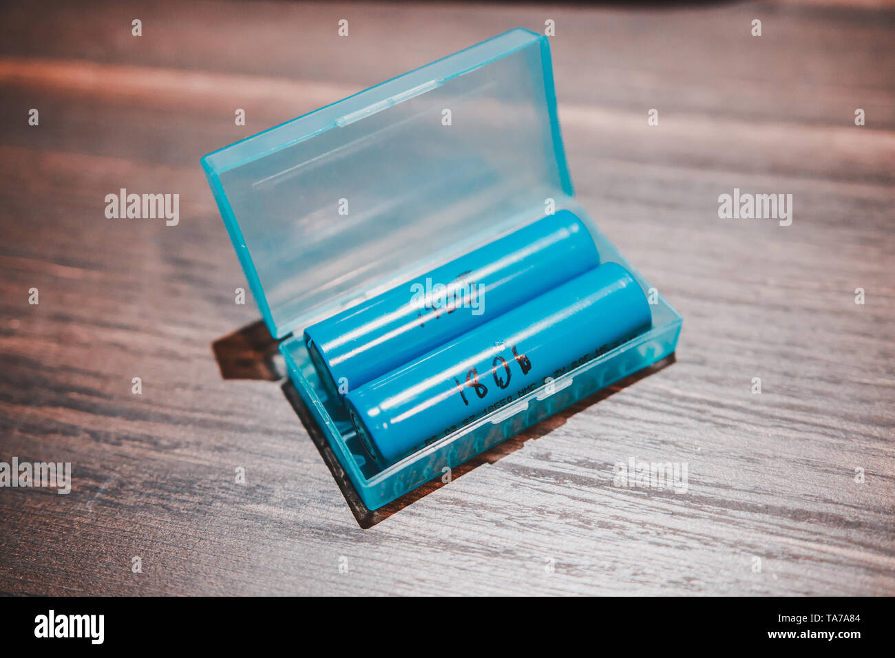 Blue 18650 Lithium Ion Battery cell inside a plastic container, known ...