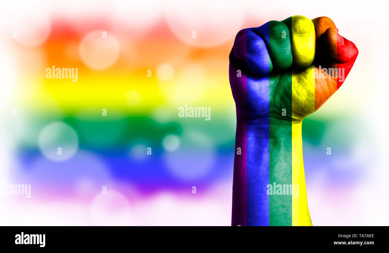 Flag of lgbt painted on male fist, strength,power,concept of conflict ...