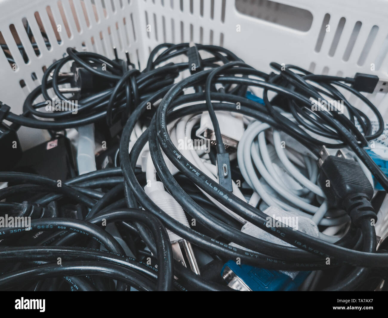 Lots of tangle electrical and computer connector cord/wire stored ...