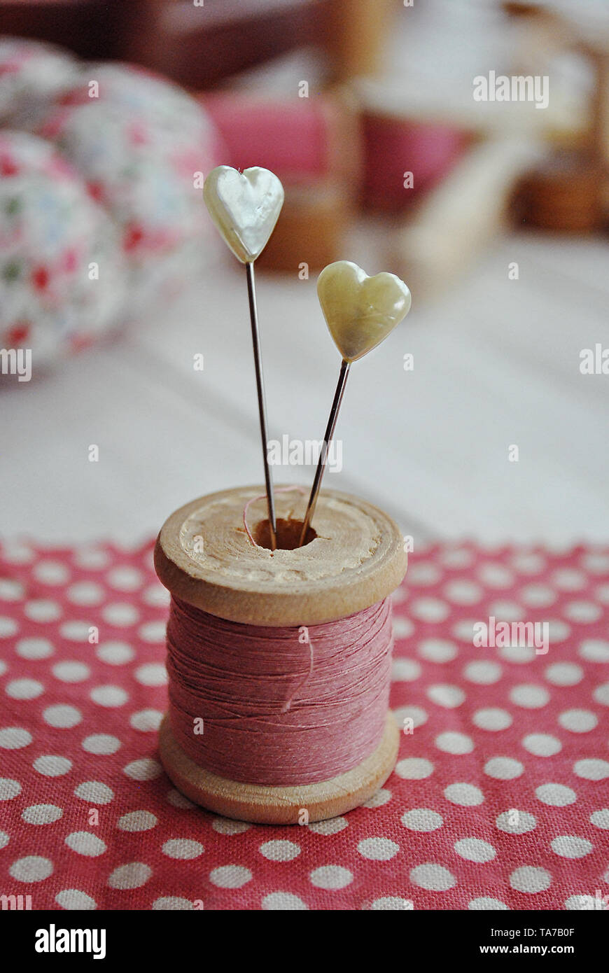 LOVELY SEWING TOOLS BACKGROUNDS. NEEDLES, BOBBIN, PINK POLKA DOT FABRIC ...