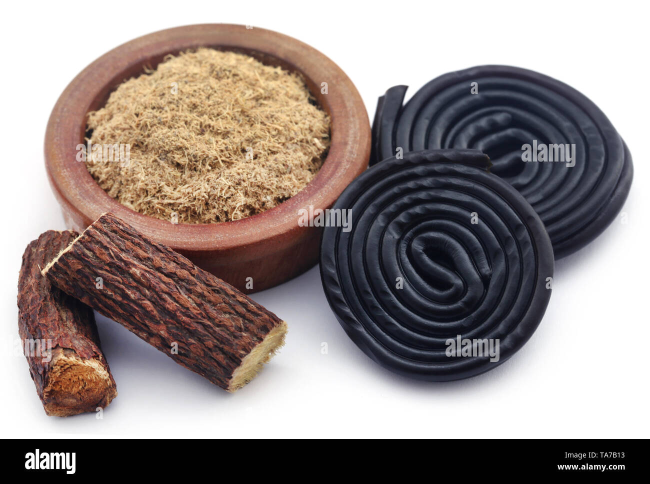 Liquorice powdere with candy over white background Stock Photo - Alamy