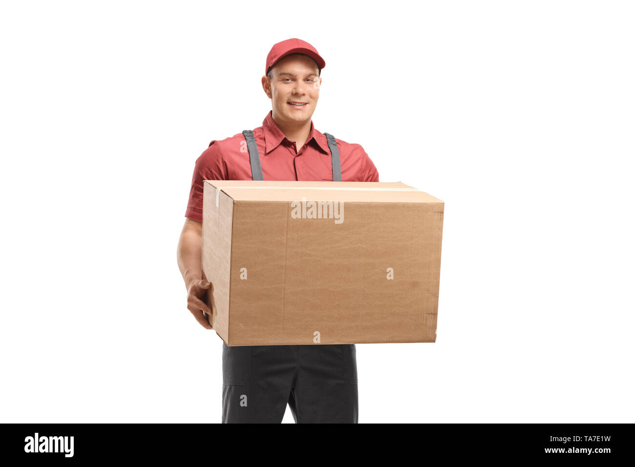 Delivery man holding a cardboard box isolated on white background Stock ...