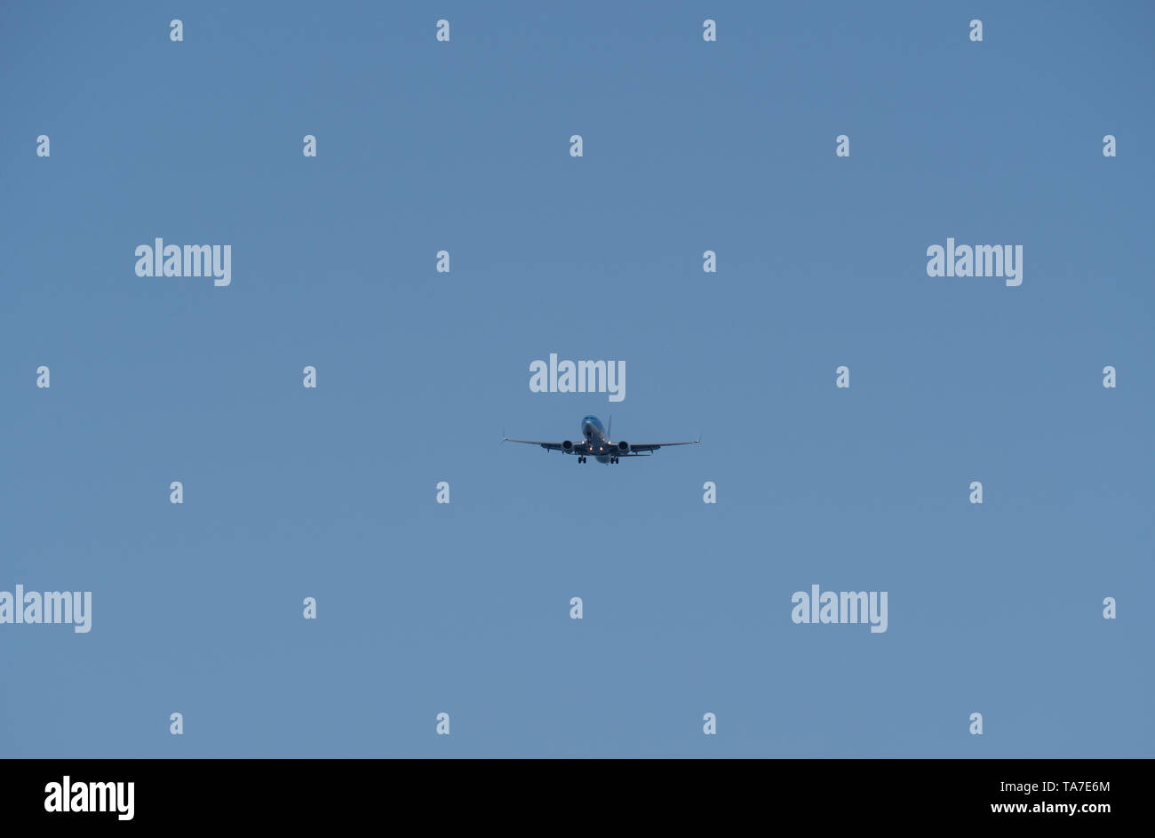 Big passenger airplane flying in blue sky Stock Photo - Alamy
