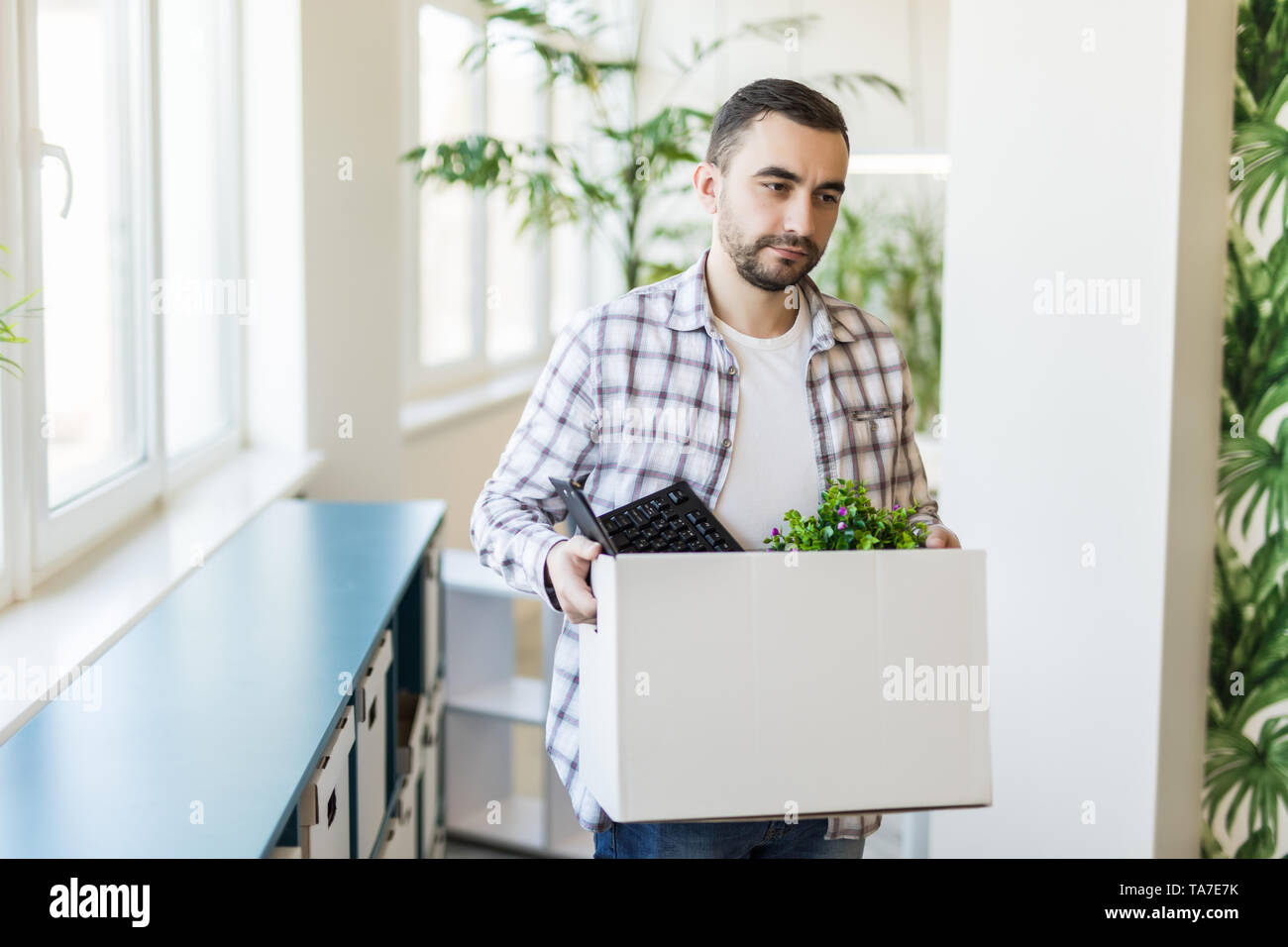 business, firing and job loss concept - fired male office worker with ...