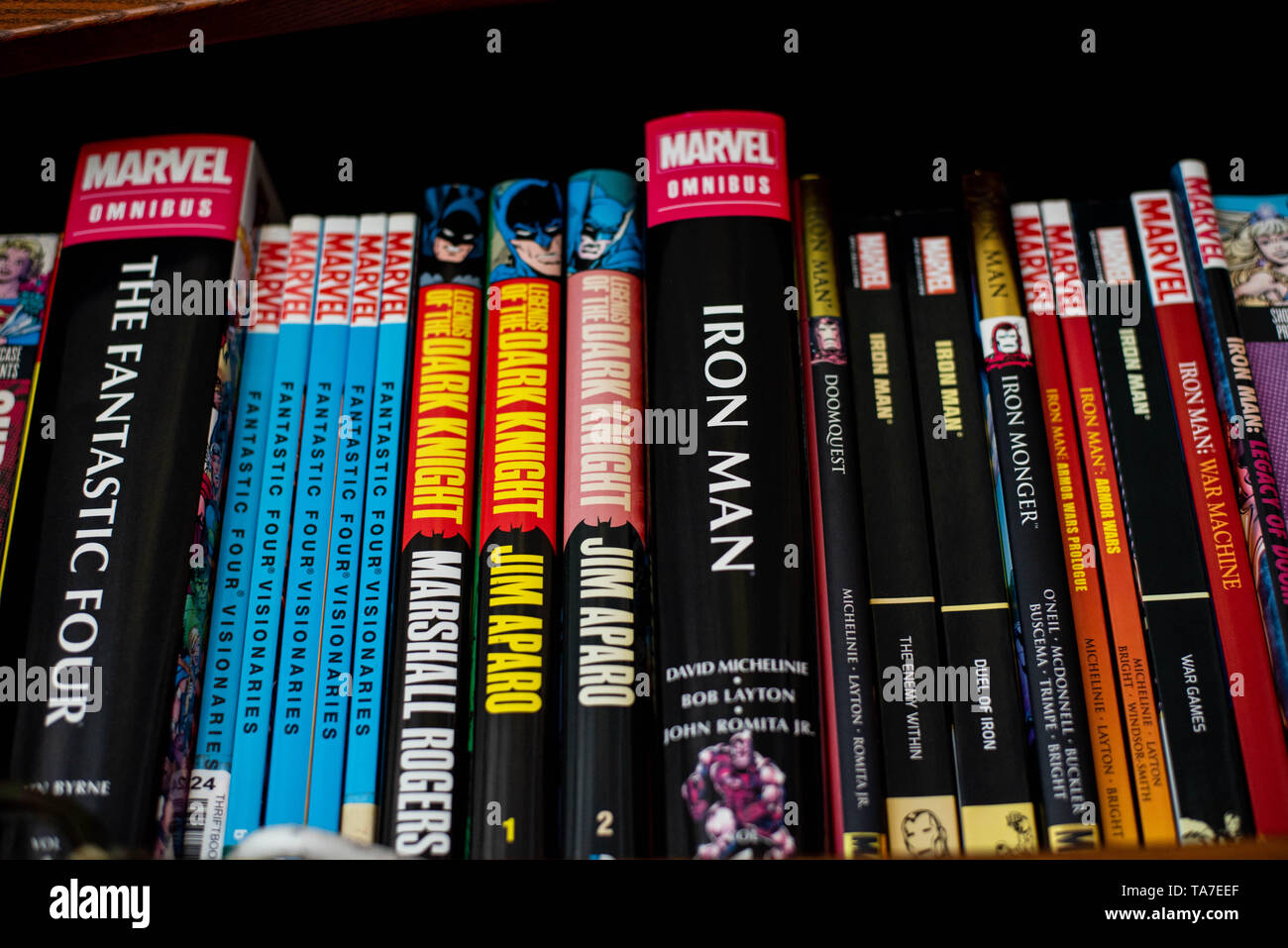 Comic book collections sit on a shelf Stock Photo - Alamy