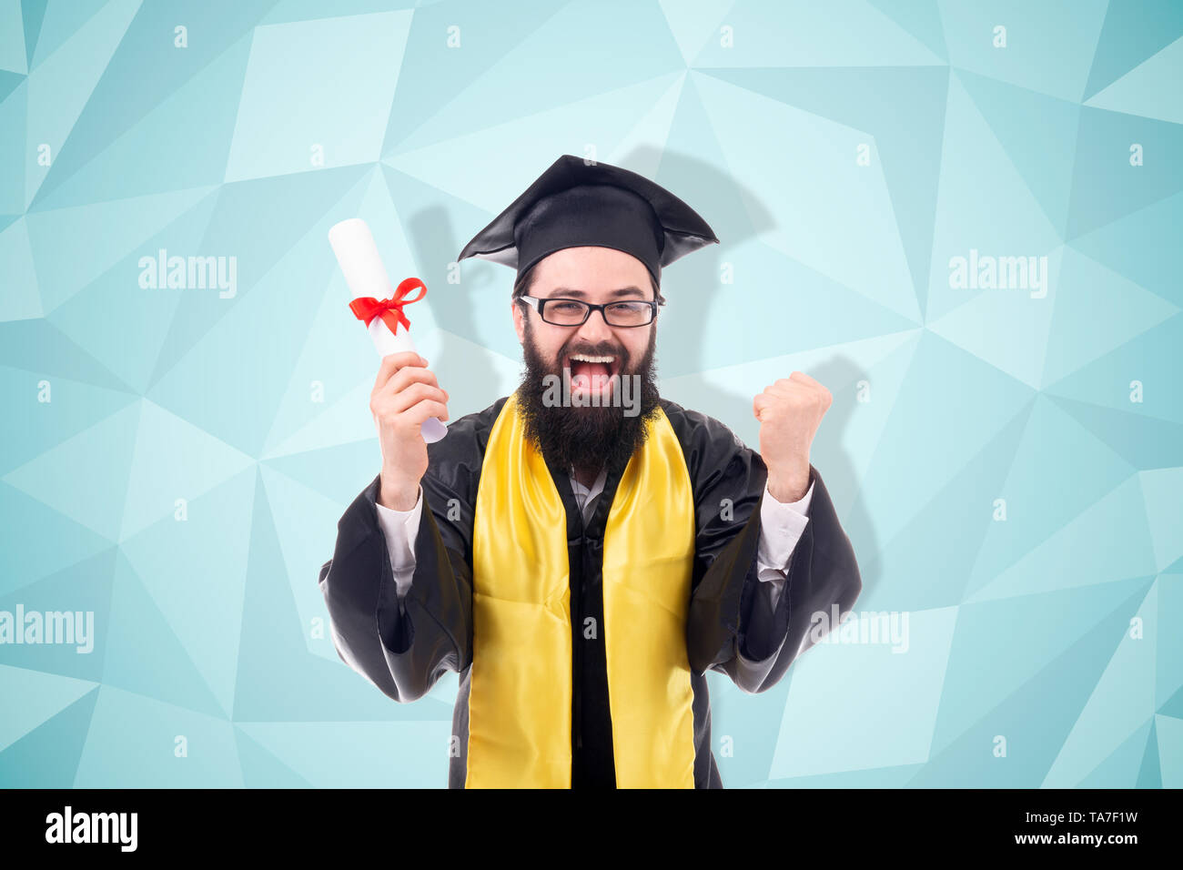 graduate with a diploma in hand, rejoices at successful completion of ...