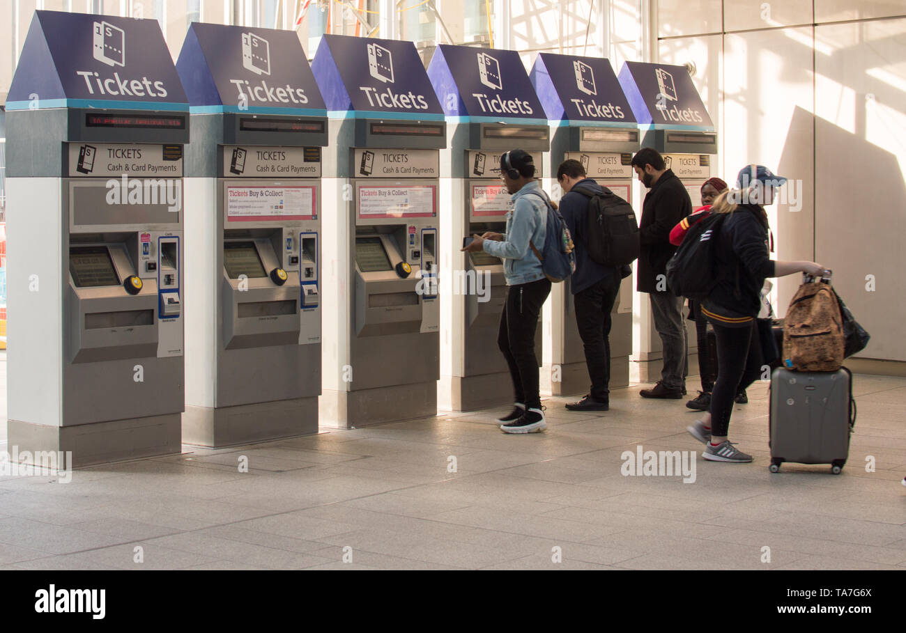 Rail ticket machine operated by travellers in London Bridge station ...