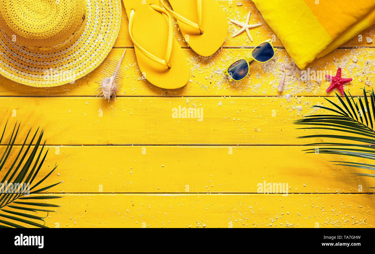 Yellow Summer Background With Beach Accessories And Palm Leaves Stock ...