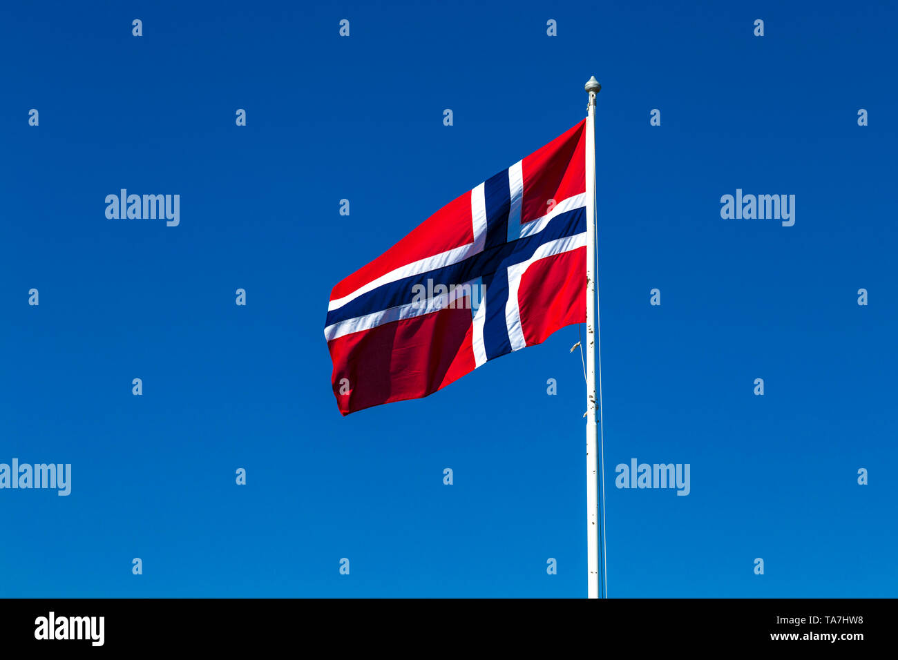 Norwegian flag against a blue sky Stock Photo - Alamy