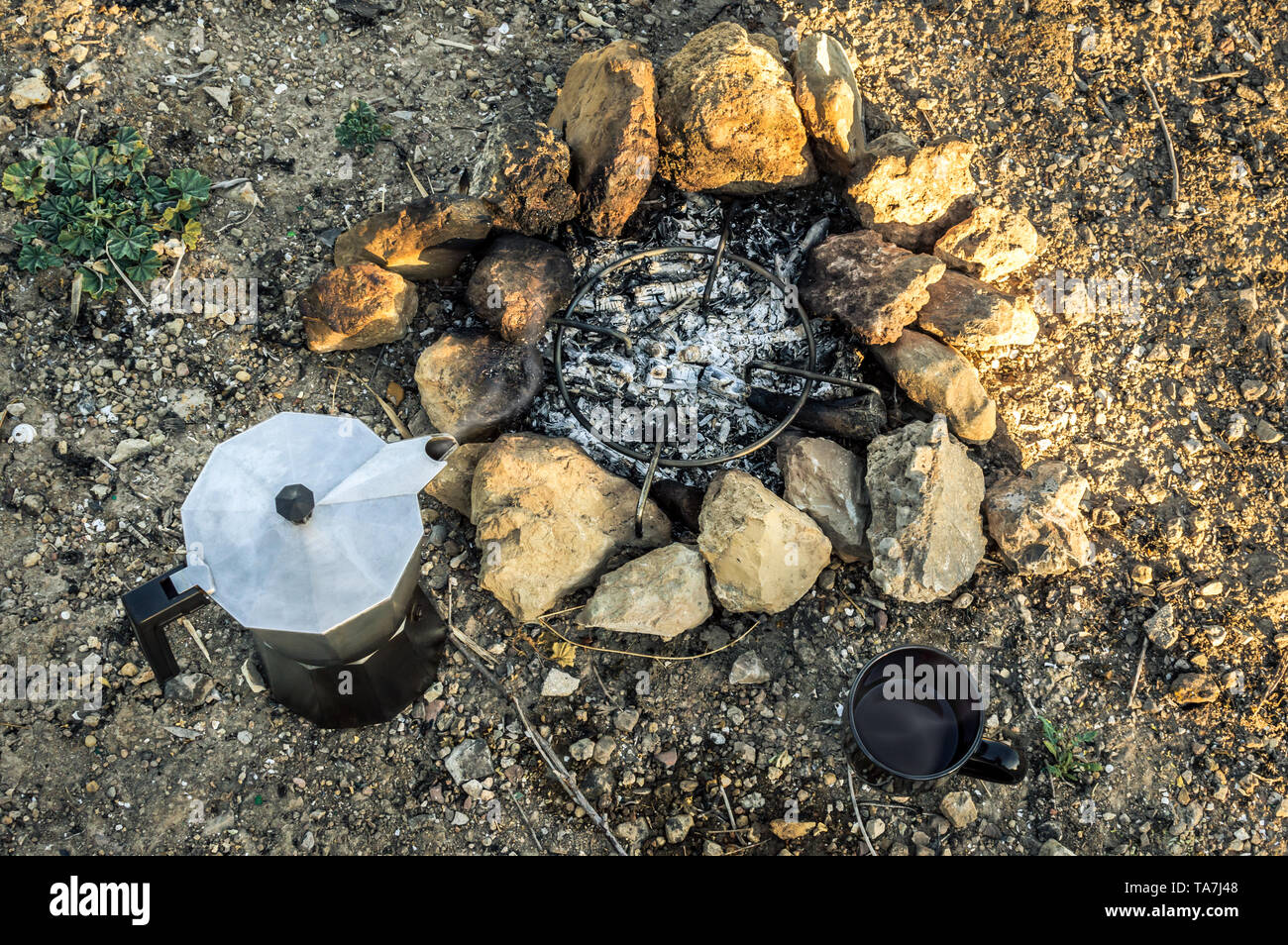 Preparing coffee using a bonfire during a camp in the forest. Bonfire ...
