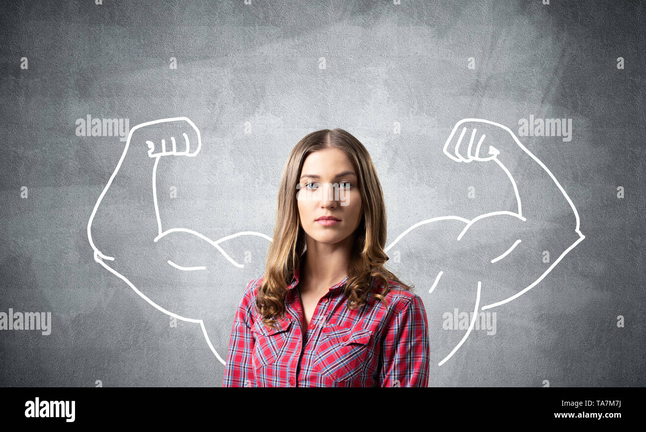 Young woman having serious and calm face Stock Photo - Alamy