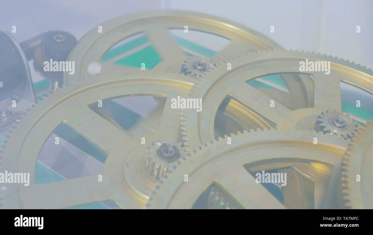 Gear wheels system rotation Stock Photo - Alamy