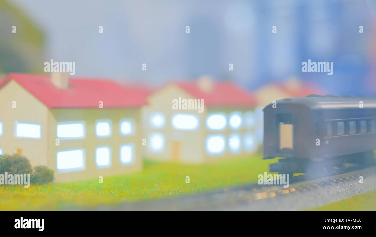 Toy hobby railroad layout with train and houses Stock Photo - Alamy