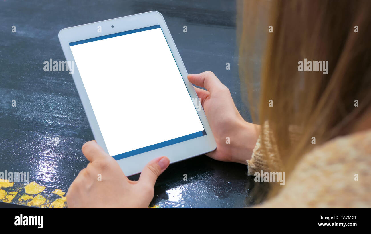 Woman looking at tablet computer with white empty display Stock Photo ...