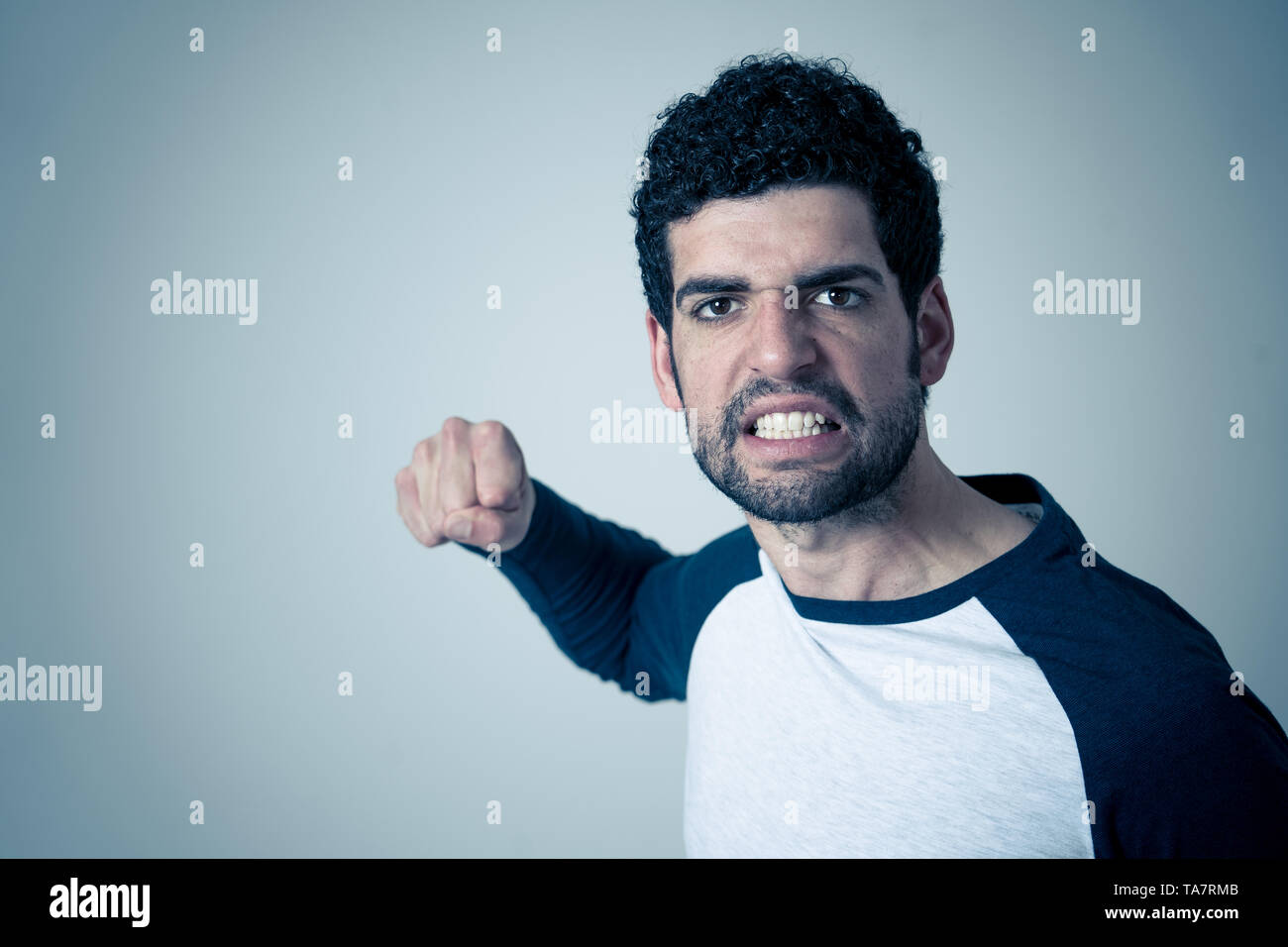 Portrait of young hipster male looking furious with angry displeased ...