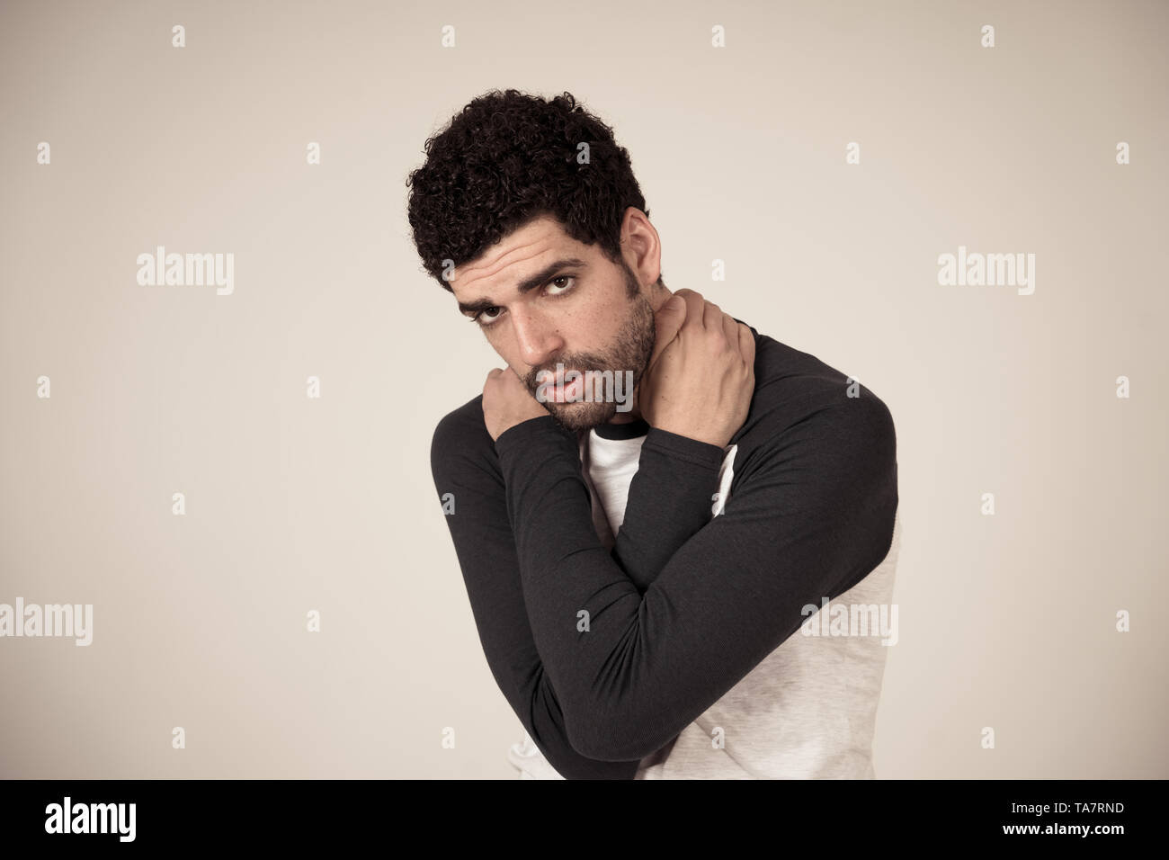 Young sad man, worried and concerned, looking depressed and desperate ...