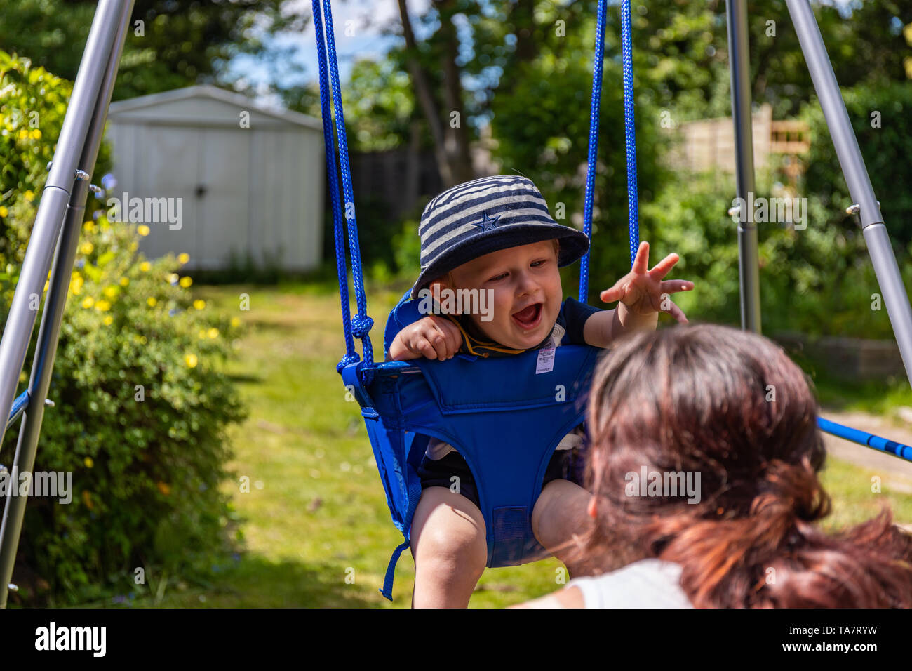 Baby enjoying time with his mother Stock Photo - Alamy