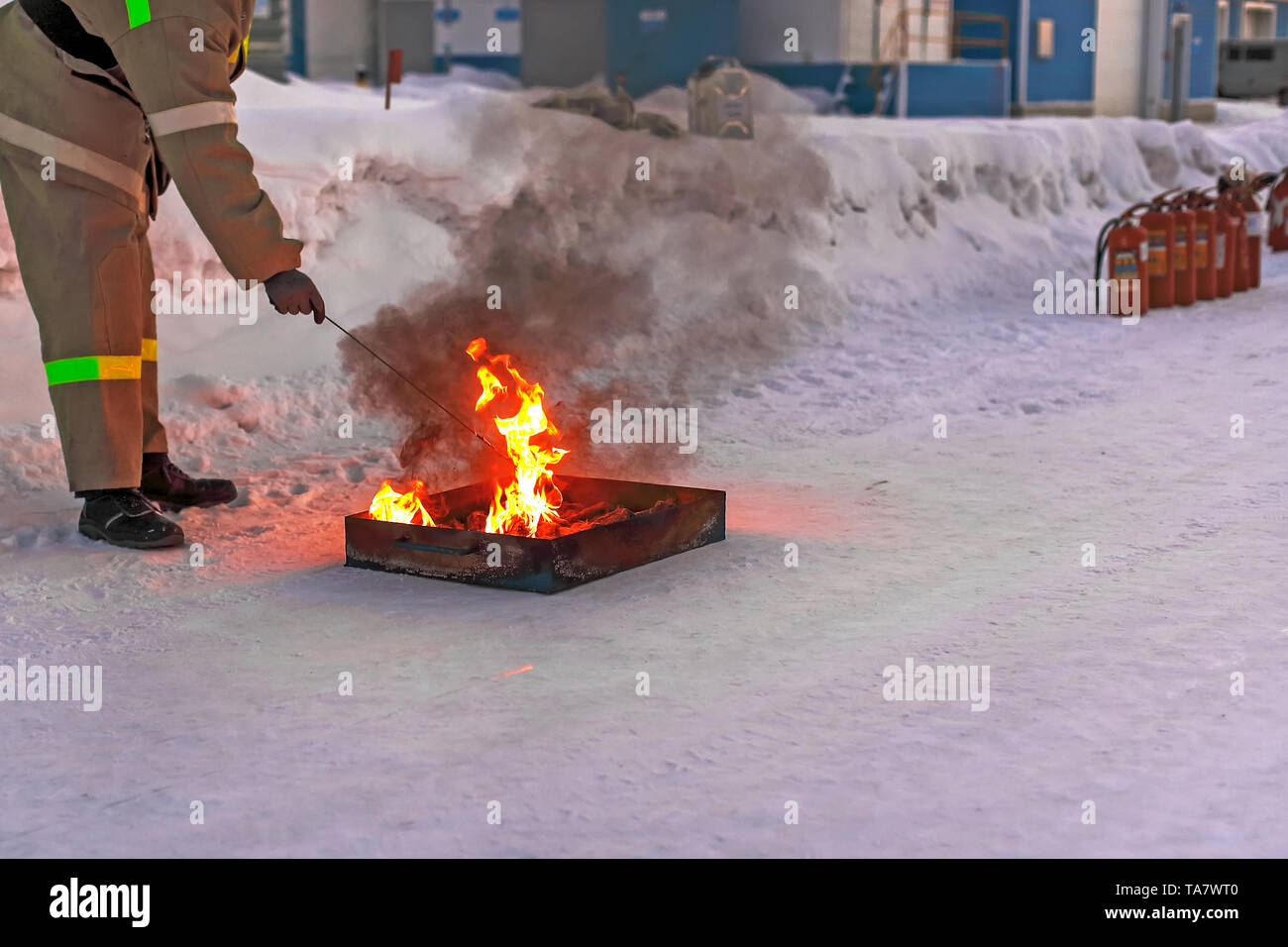 Fireman makes a fire outdoors. Preparation for training on fire ...