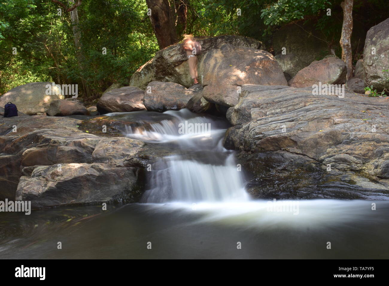 Kumbakkarai Water Falls and the Pambar river flows along the rocks ...