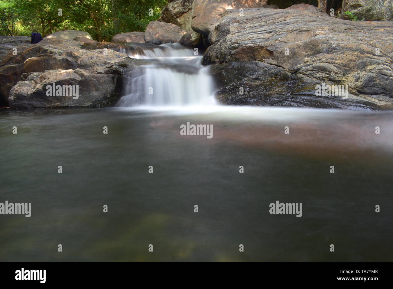 Kumbakkarai Water Falls and the Pambar river flows along the rocks ...