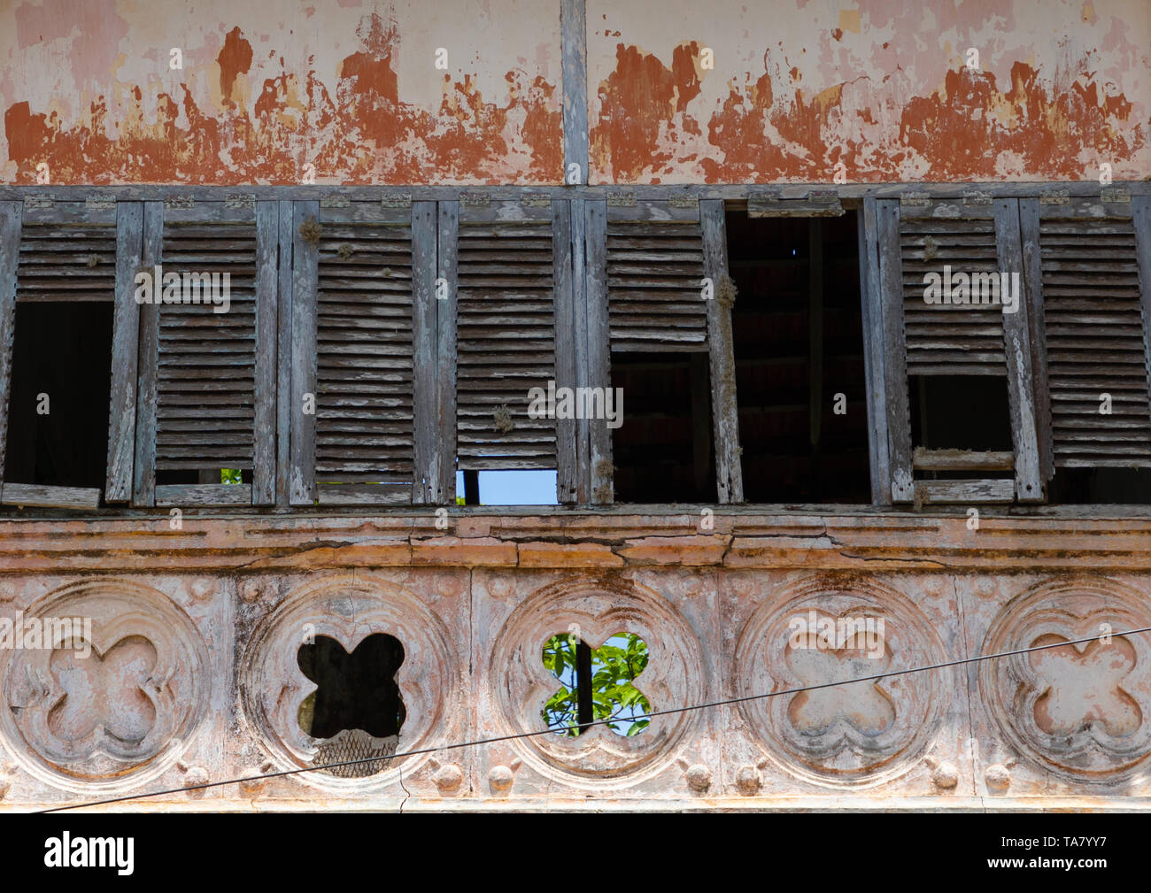 Windows of an old old french colonial building, Sud-Comoé, Grand-Bassam ...