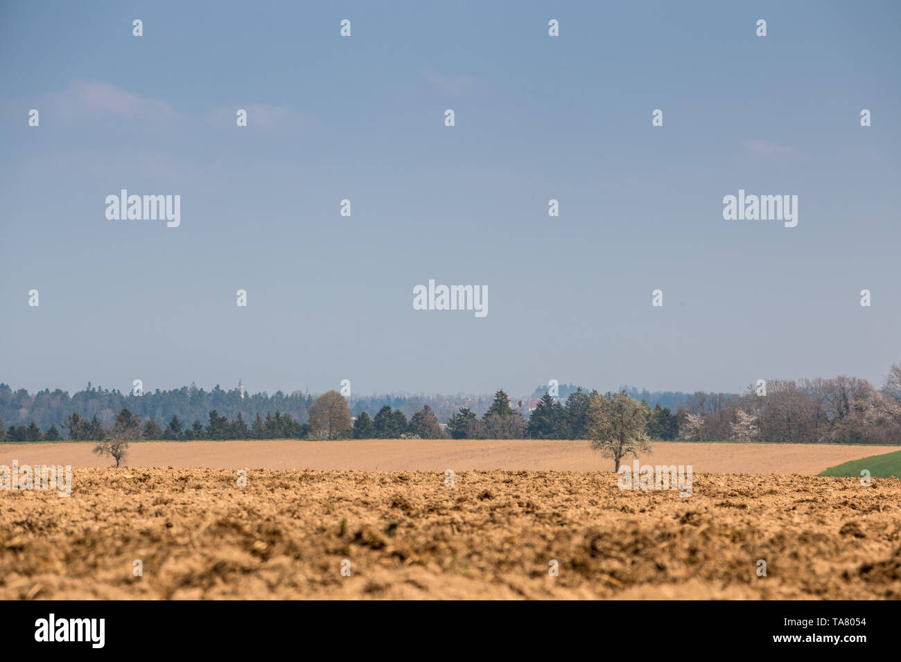 Big fields in the middle of the german countryside with hills, forests ...