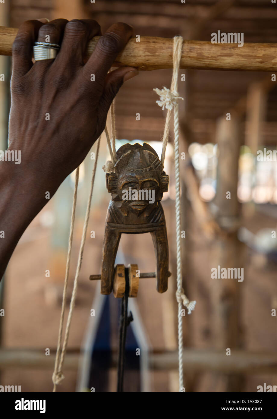 Figural heddle pulley in a traditional Senufo weaving factory, Savanes ...
