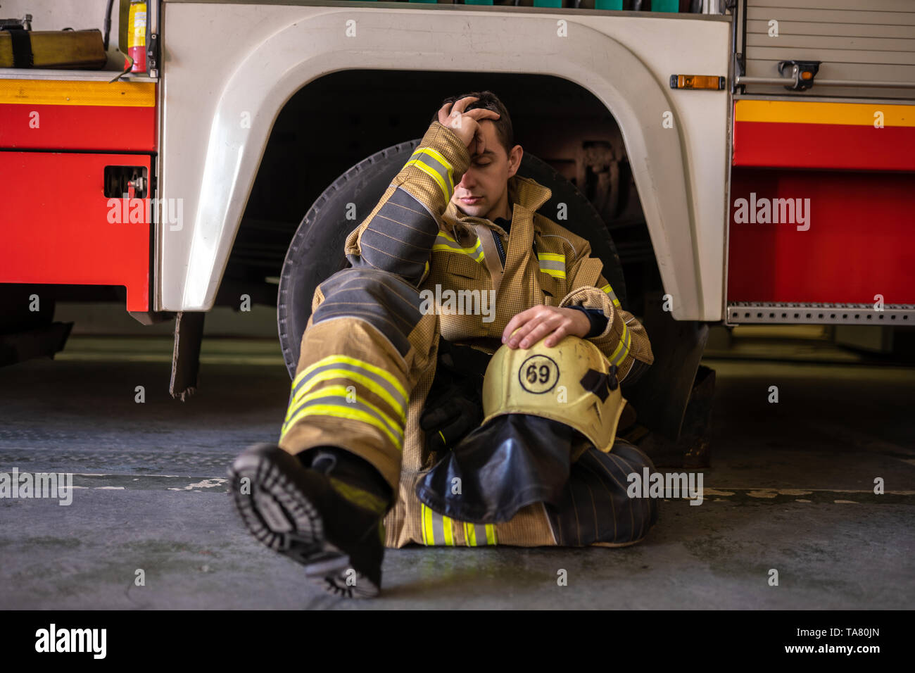 Tired fireman hi-res stock photography and images - Alamy