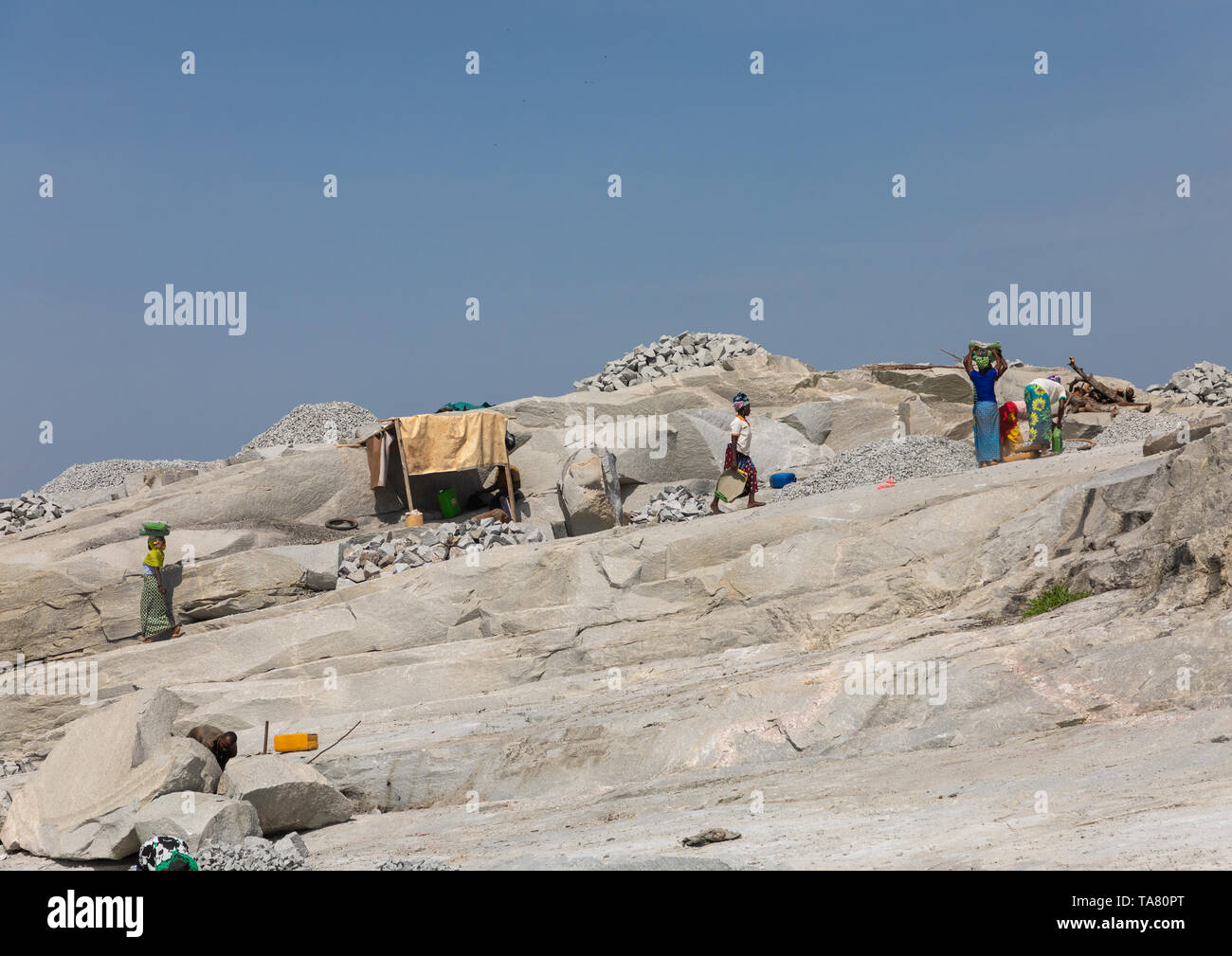 African people working in a granite quarry, Savanes district, Shienlow ...