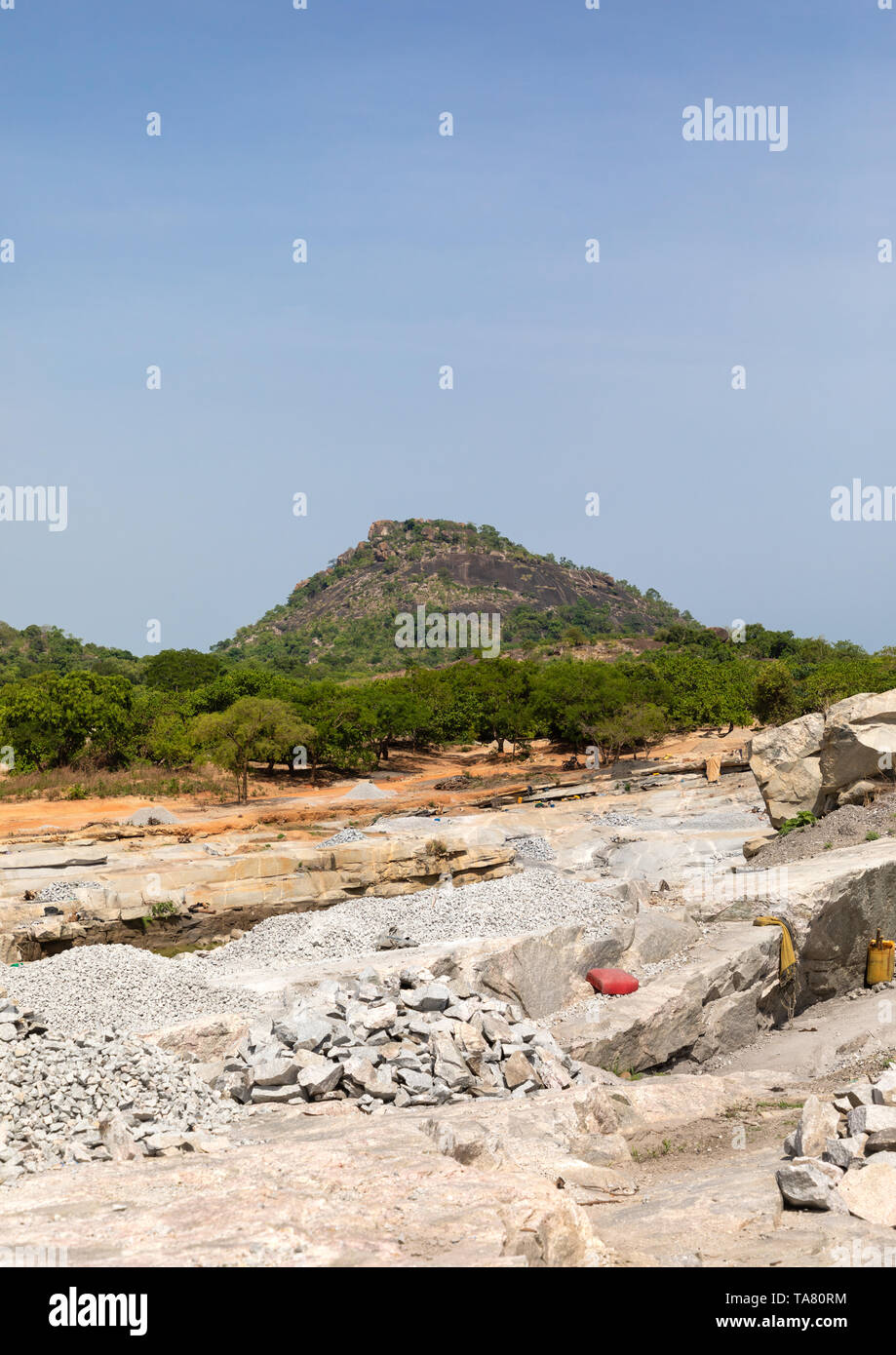 African people working in a granite quarry, Savanes district, Shienlow ...