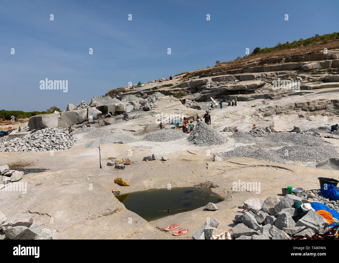African people working in a granite quarry, Savanes district, Shienlow ...