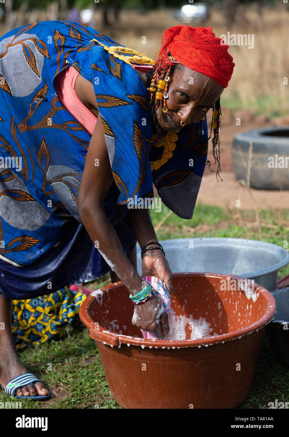 Woman washing clothes in bucket hi-res stock photography and images - Alamy