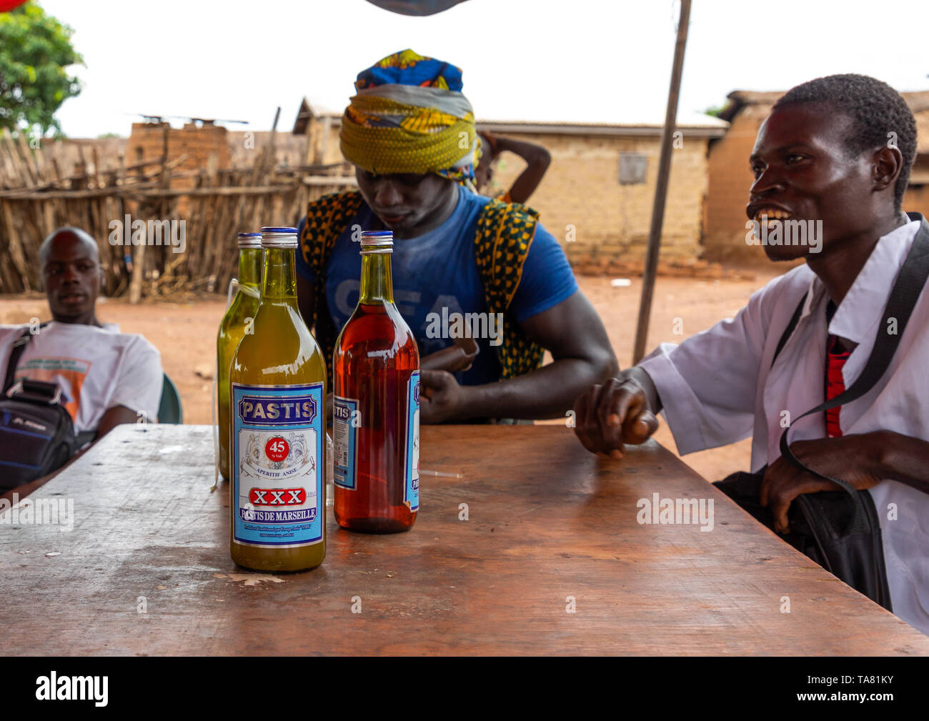 Senufo young men drinking pastis during the poro society age-grade ...