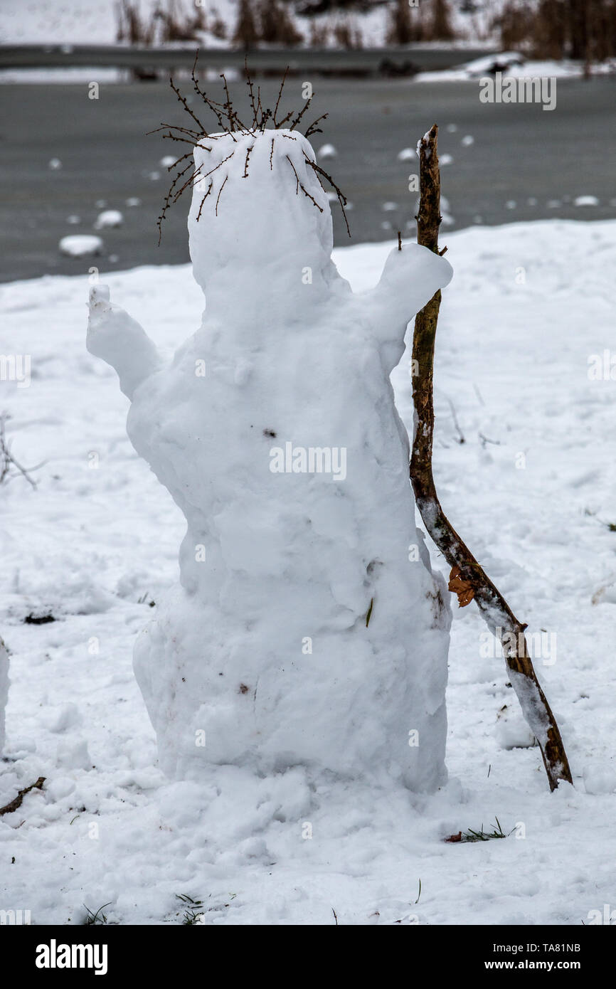 Snowman with walking stick hi-res stock photography and images - Alamy