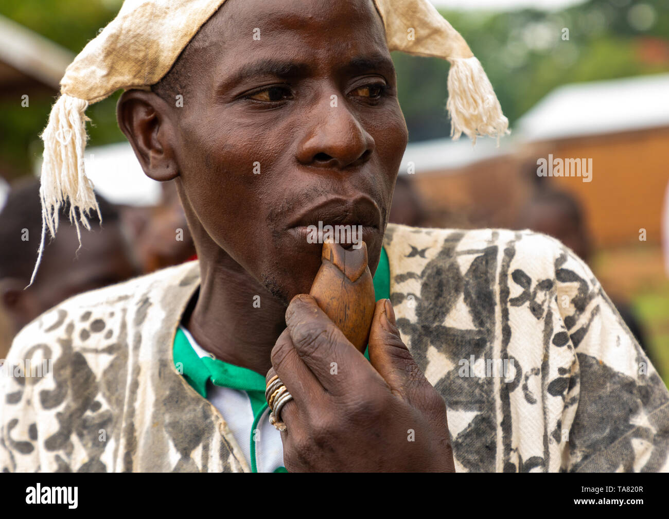 African man blowing flute hi-res stock photography and images - Alamy