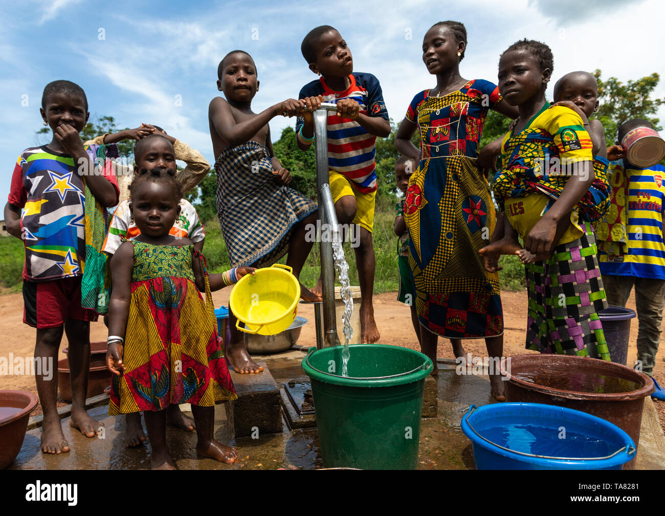 Children collecting water from well hi-res stock photography and images ...