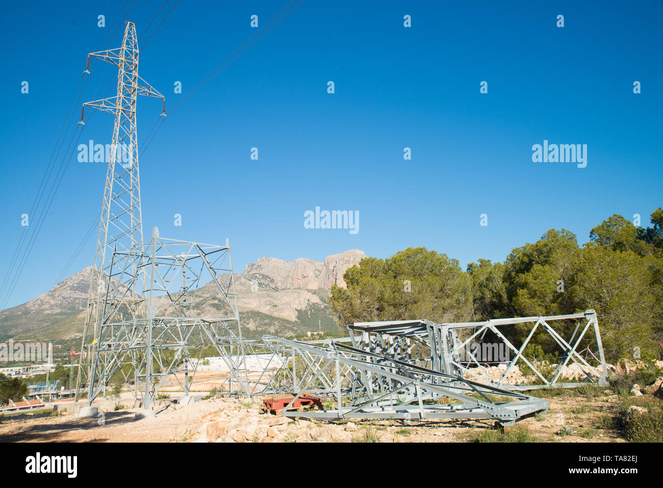Unfinished electricity pylon with part of it still on the ground Stock ...