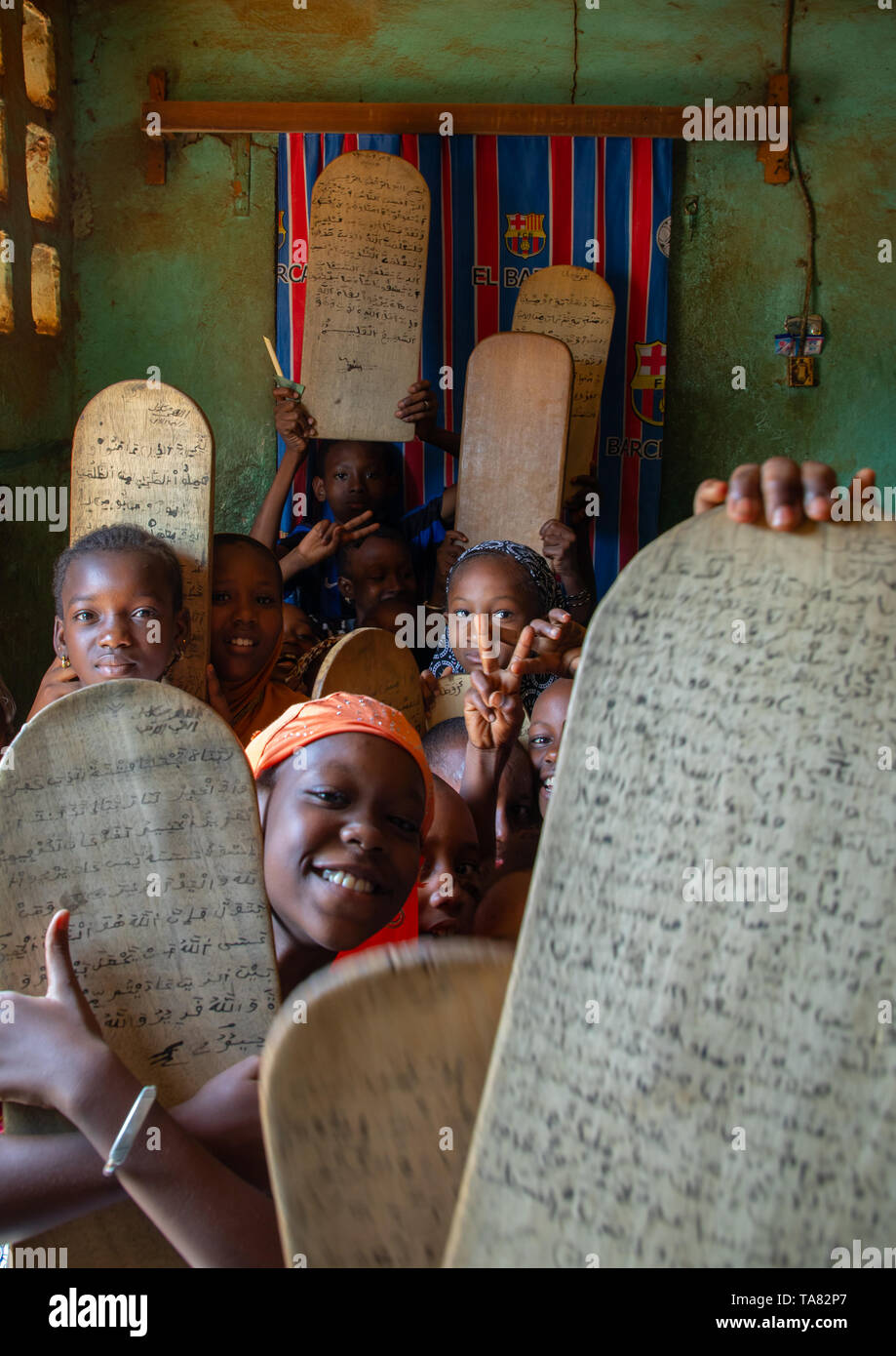 Children with wood boards for writing koran in a koranic school, Tonkpi ...