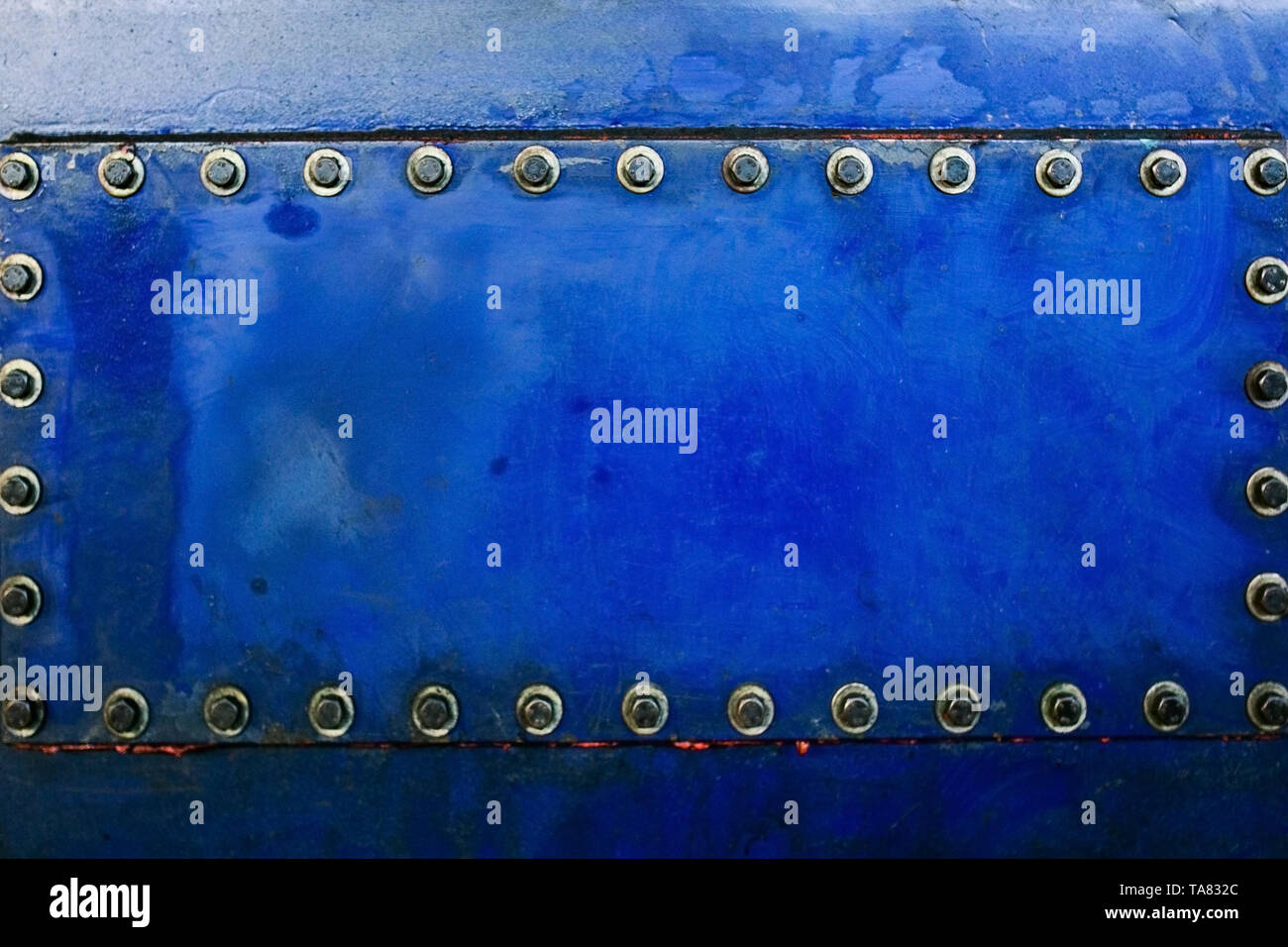 Industrial background texture with blue metal with bolts and rivets ...