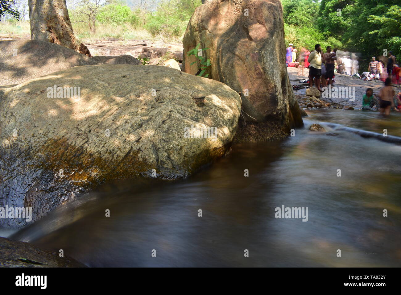 Kumbakkarai Water Falls and the Pambar river flows along the rocks ...