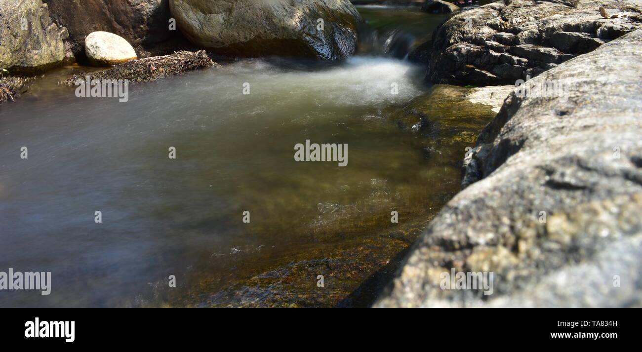 Kumbakkarai Water Falls and the Pambar river flows along the rocks ...