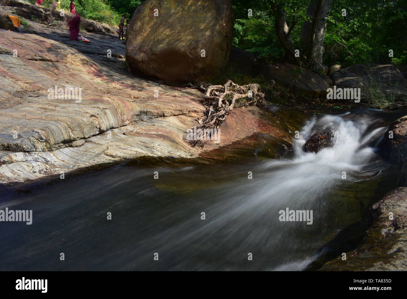 Kumbakkarai Water Falls and the Pambar river flows along the rocks ...