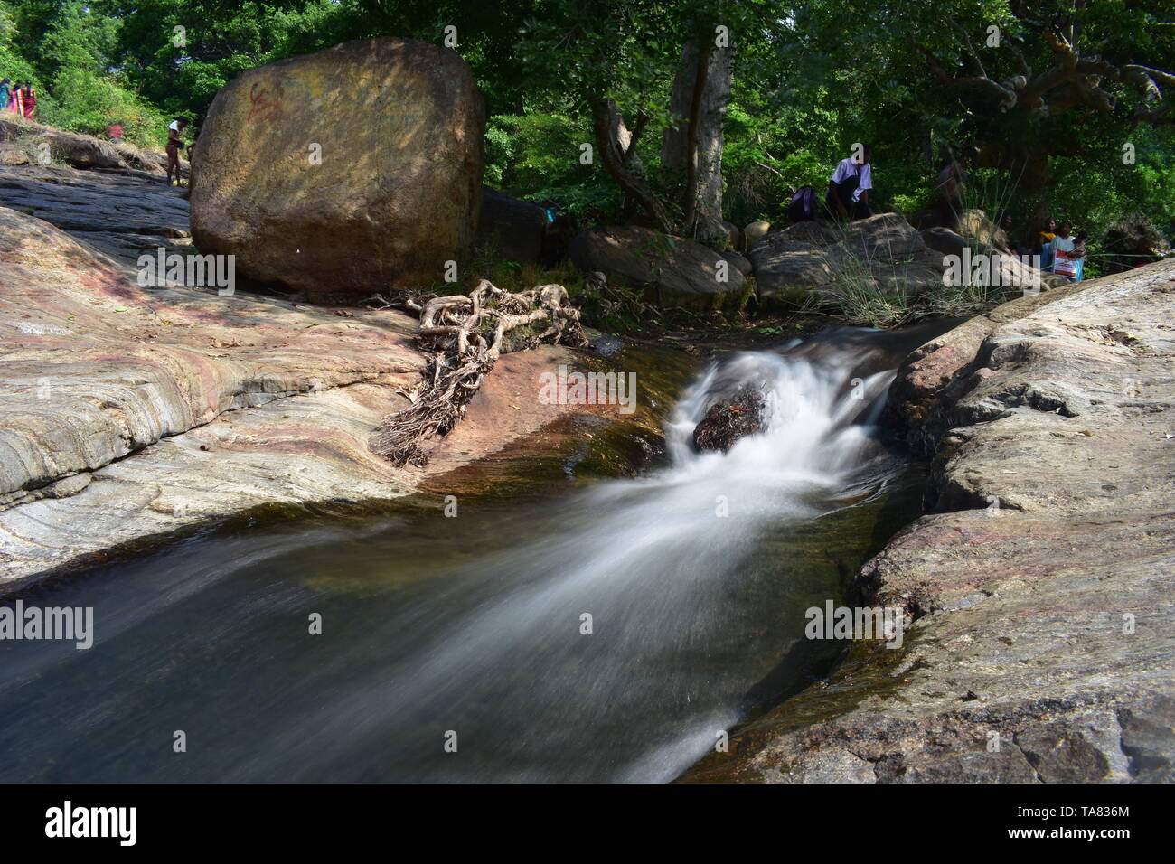 Kumbakkarai Water Falls and the Pambar river flows along the rocks ...