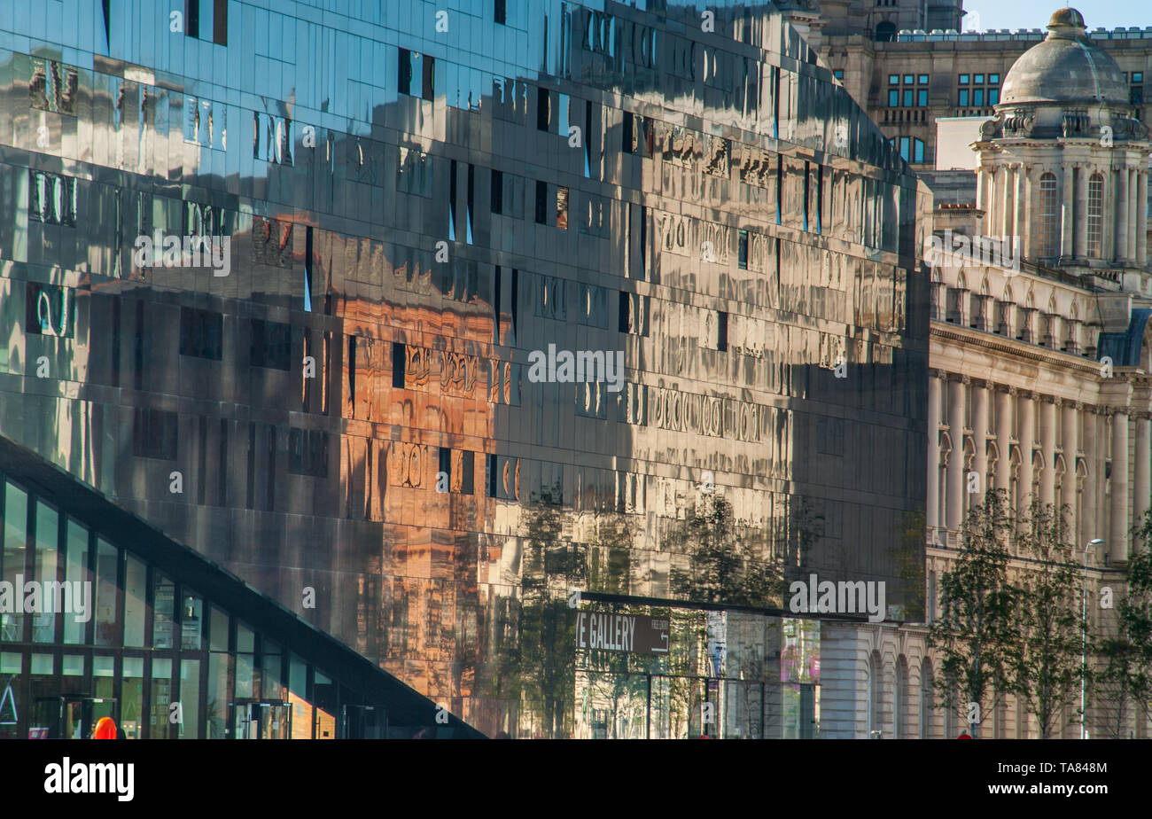 building reflected on glass facade wall of building Beautiful and ...