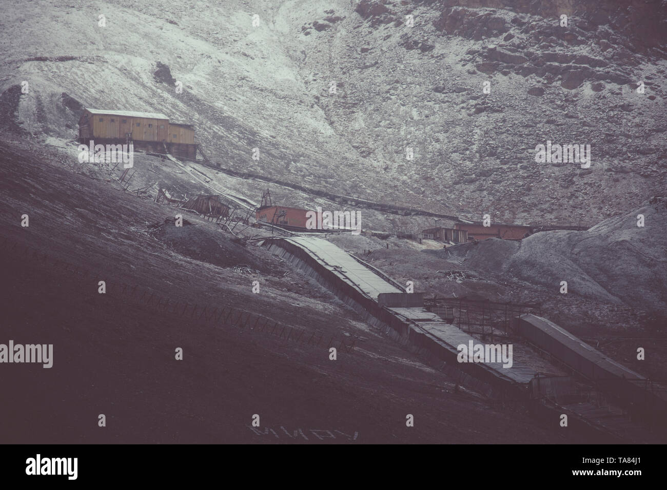 The sudden abandoned russian mining town Pyramiden. coal mine alongside ...