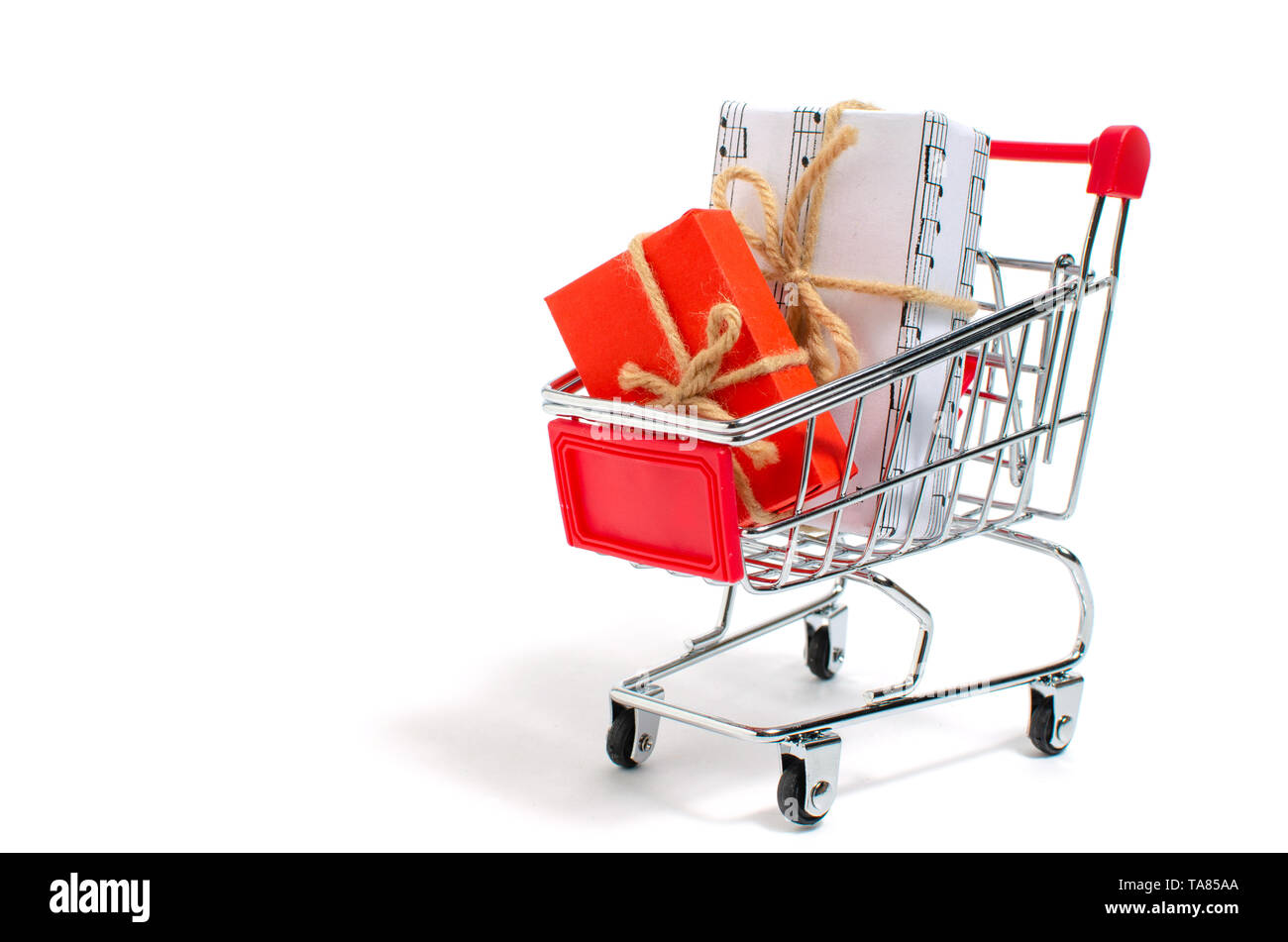Shopping cart filled with gifts on white background Stock Photo - Alamy